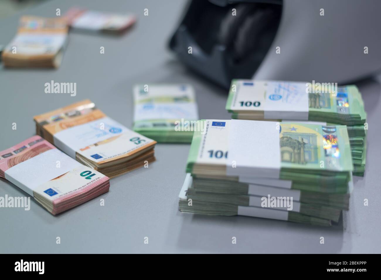 Bundles of banknotes divided into groups with currency straps placed on ...