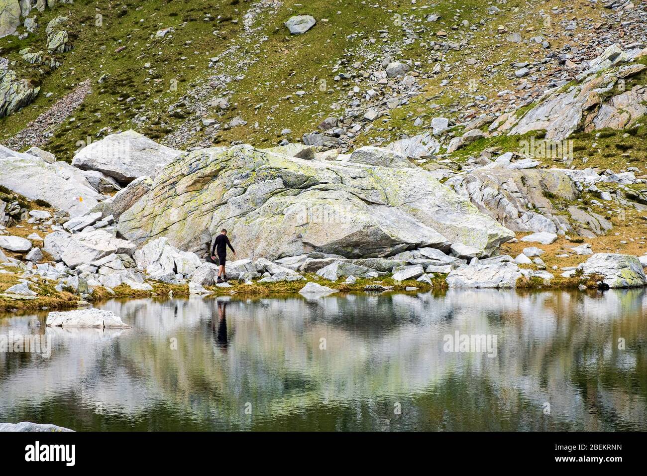 MOUNTAINS AND CLOUDS REFLECTED ON LAKE SAW DURING TREKKING Stock Photo ...