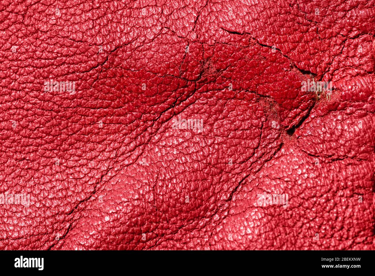 Shabby and worn red faux leather texture background with cracks and ...