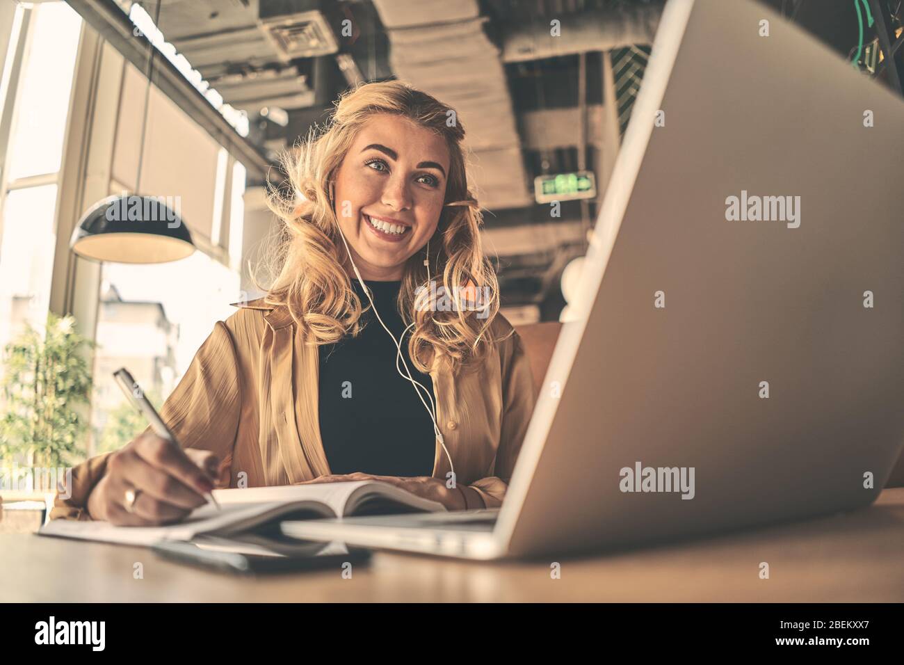 Woman use computer at cafe Stock Photo - Alamy
