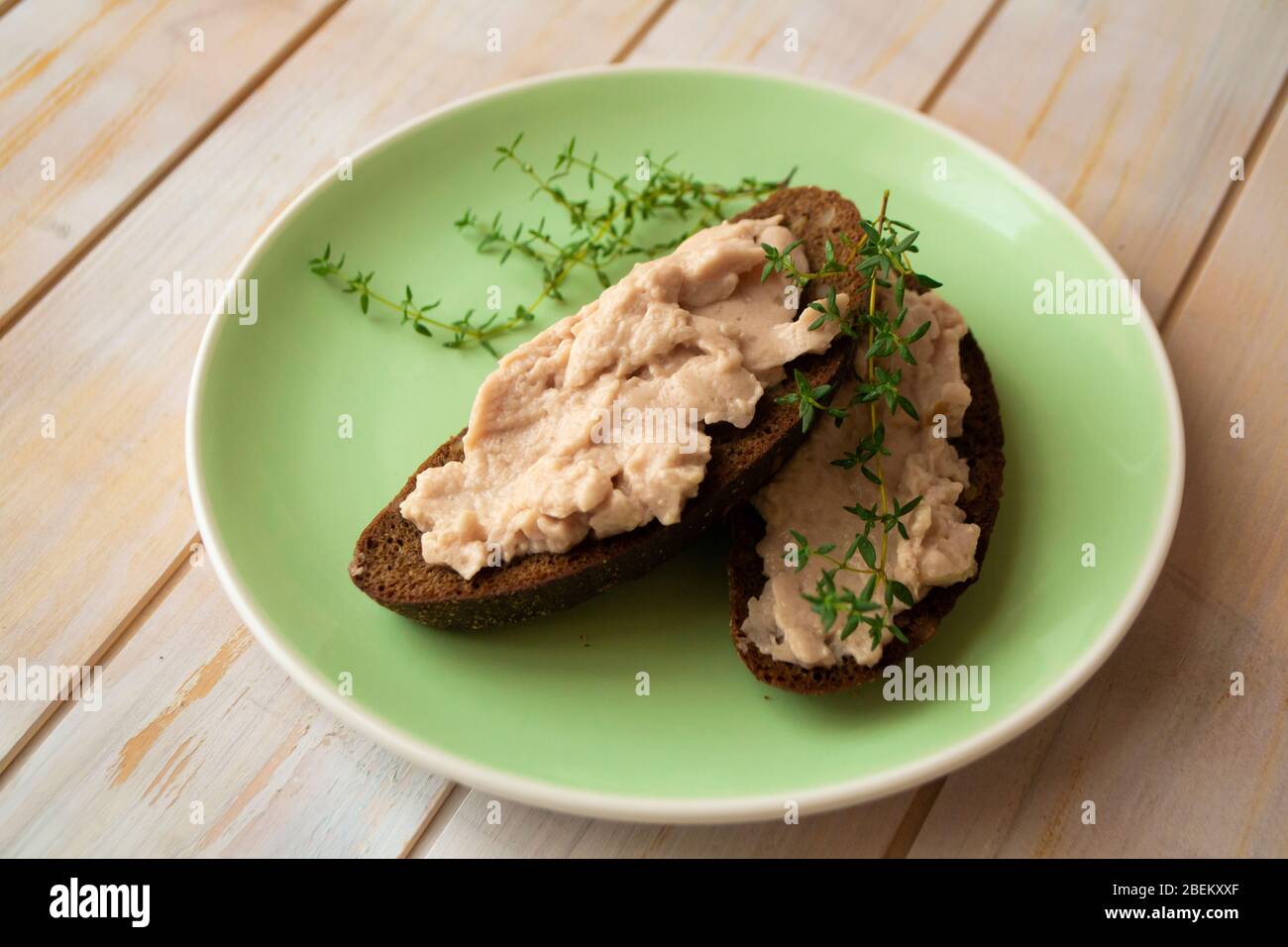 Slice of dark wheat bread and liver pate Stock Photo - Alamy