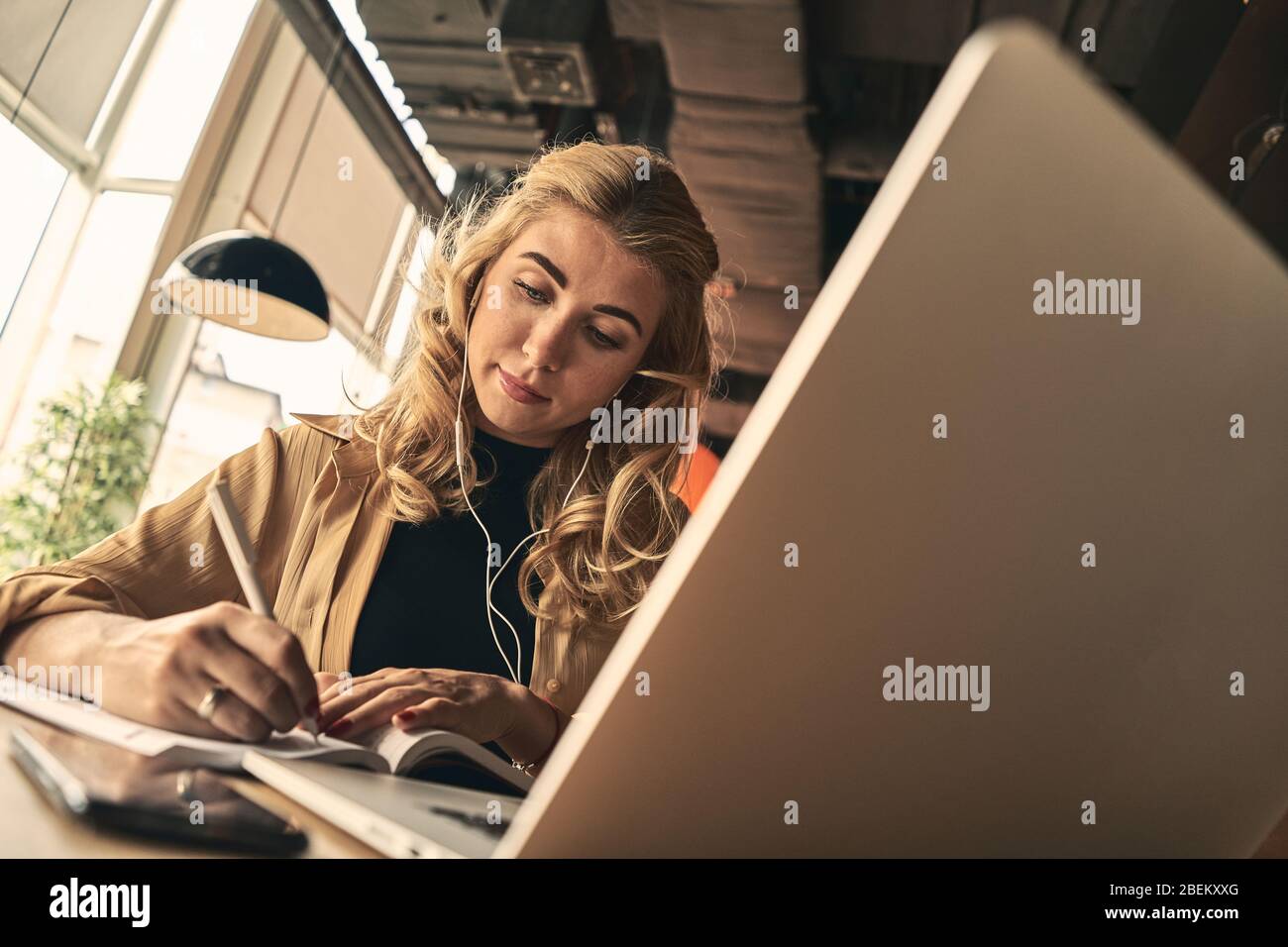 Woman use computer at cafe Stock Photo - Alamy