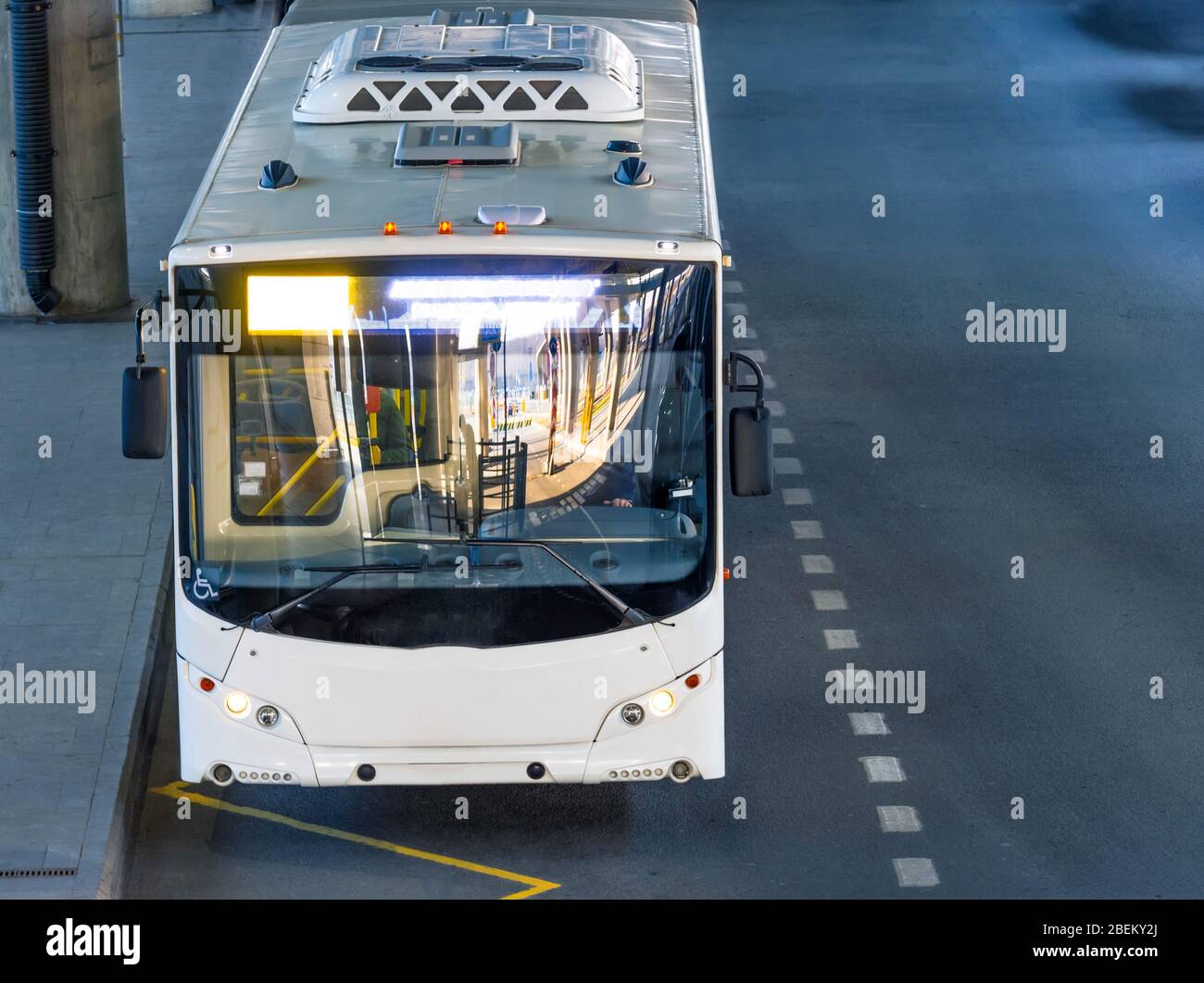 Passenger city bus at a bus stop waiting for people before departure ...
