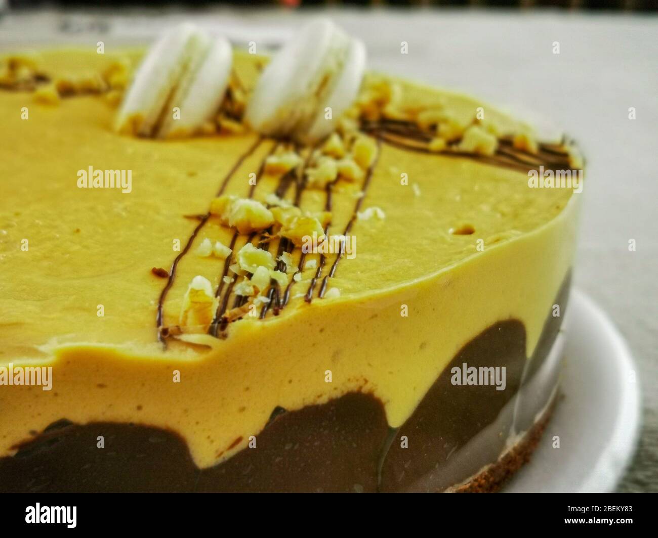 Caramel cake with powdered sugar on top, close up shot Stock Photo - Alamy