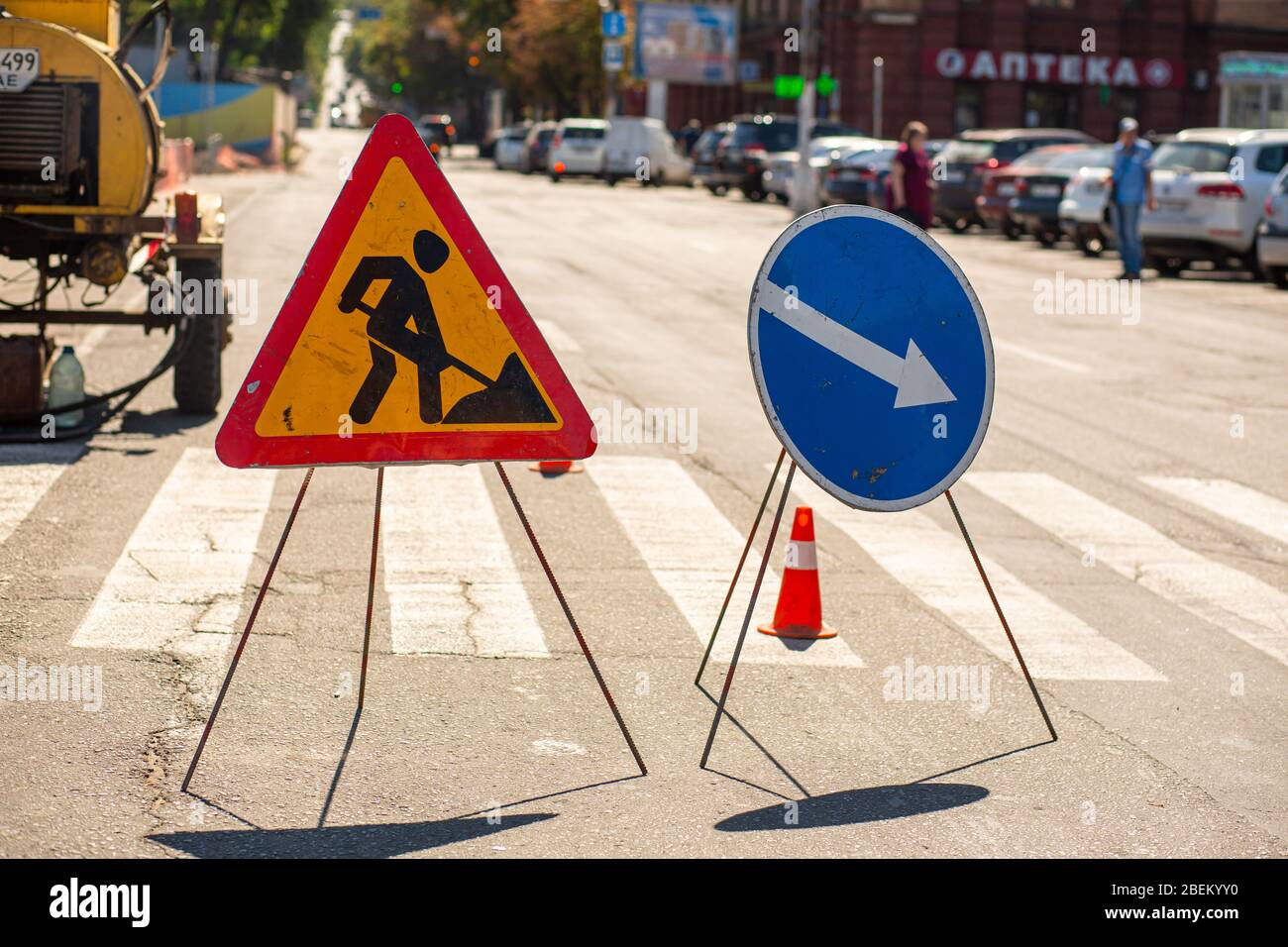 Road repair. Warning signs about repair work of a paving. Attention ...