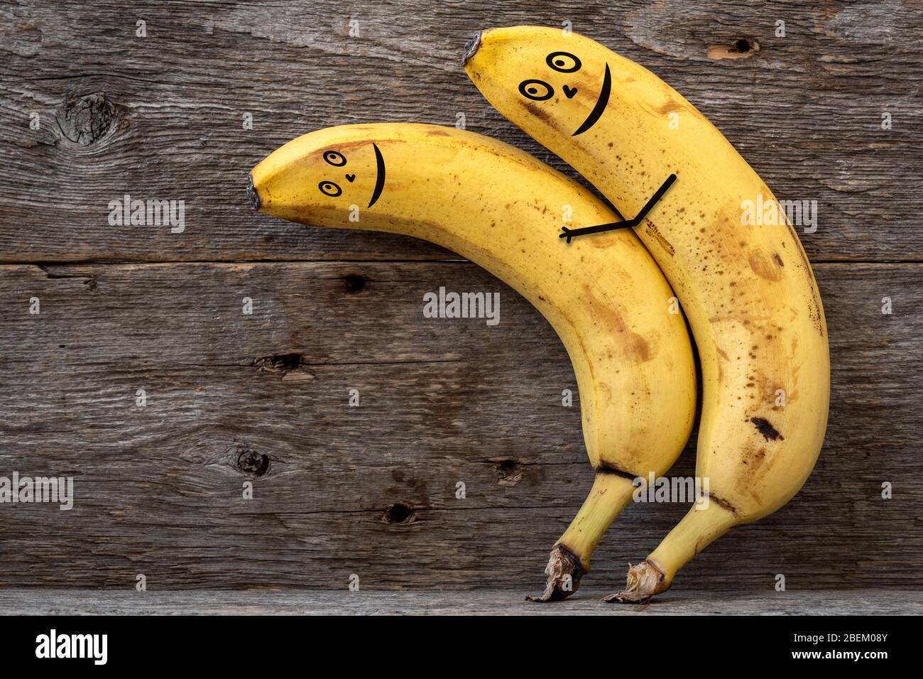 Couple of bananas hugging each other .Concept of embracing couple in ...