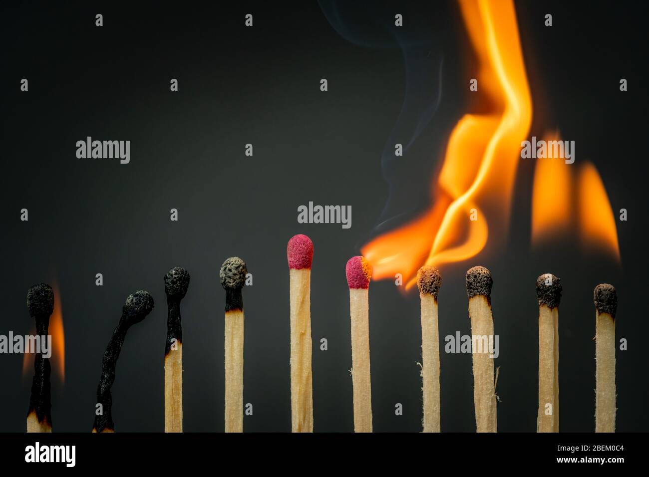 Group of wooden matches with fire burning on dark background Stock ...