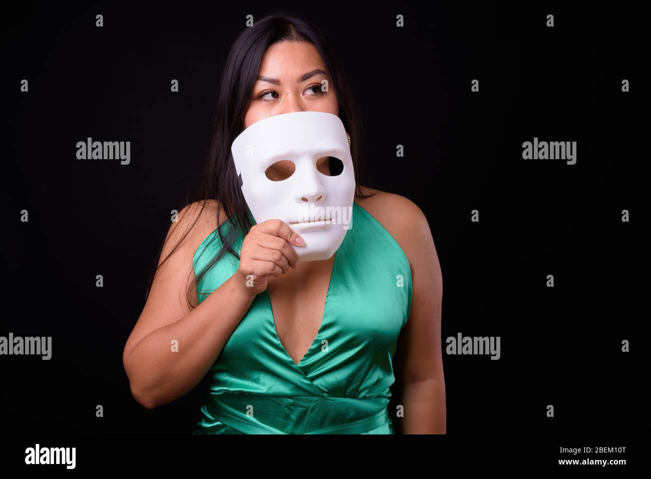 Beautiful overweight Asian woman wearing silky green dress Stock Photo ...