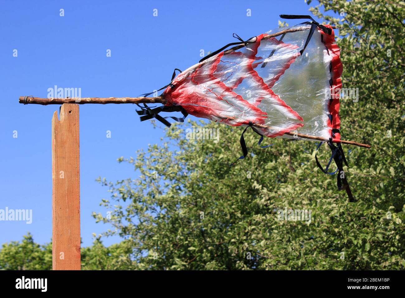 Wind-powered bird scarer in the garden. Bird scare device which helps ...