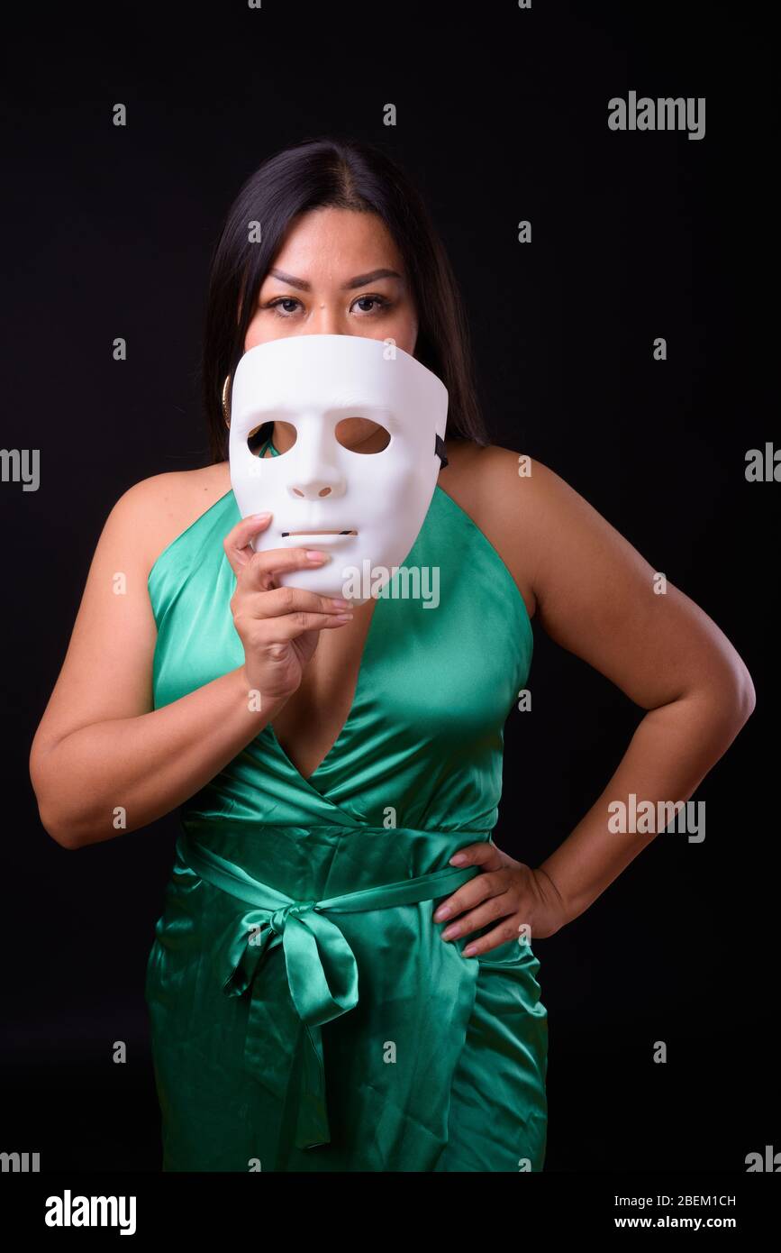 Beautiful overweight Asian woman wearing silky green dress Stock Photo ...
