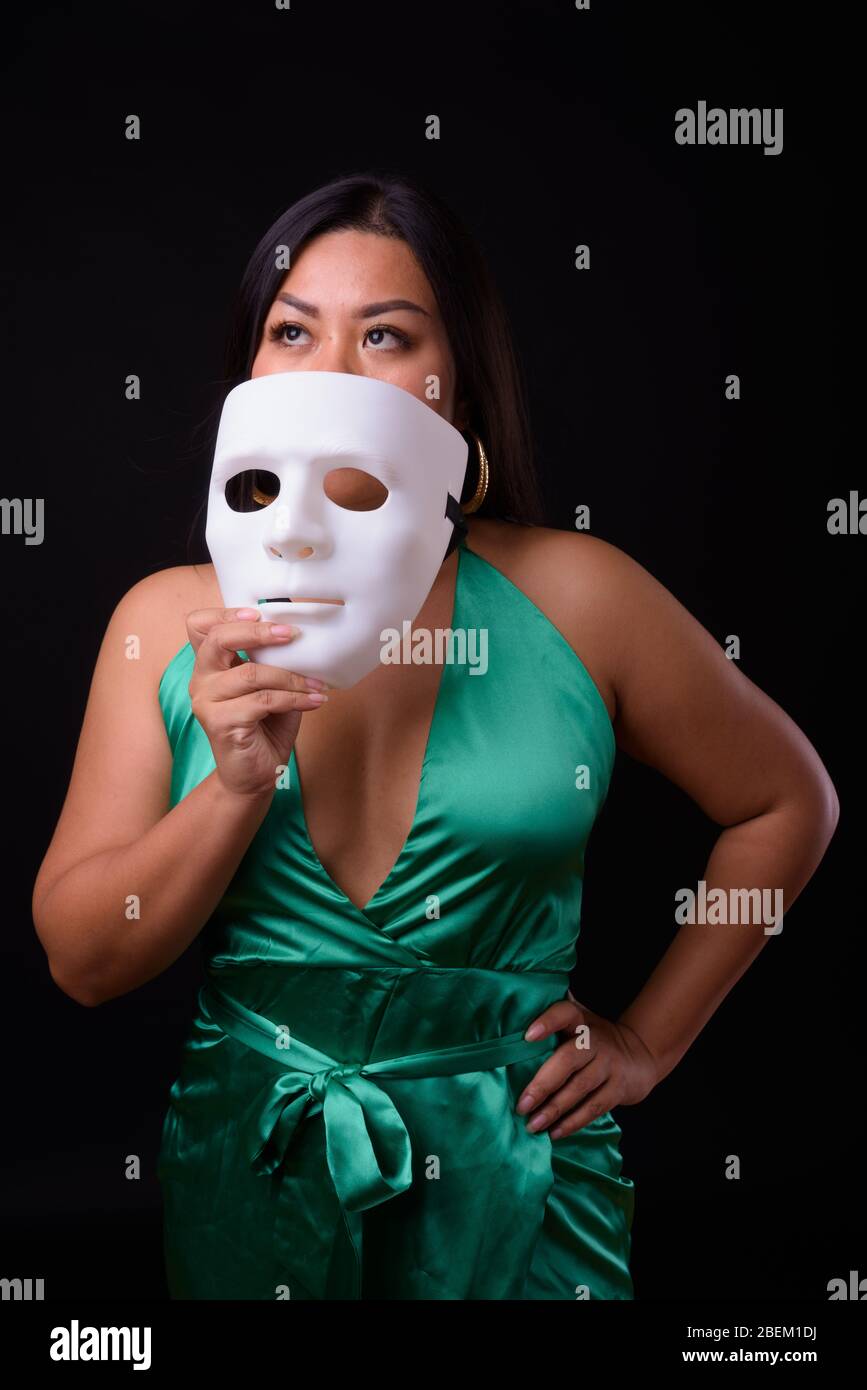 Beautiful overweight Asian woman wearing silky green dress Stock Photo ...