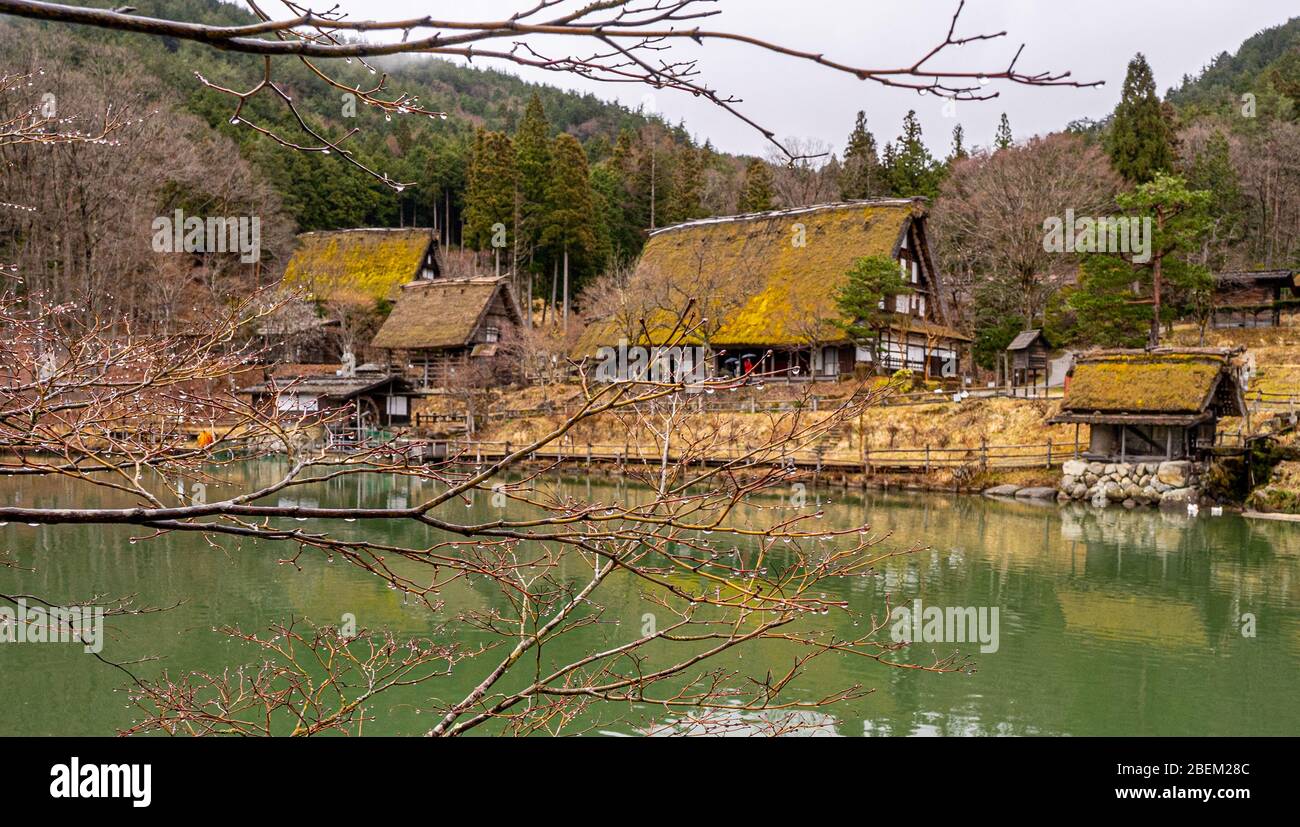 Pond and Hida Folk Village (Hida no Sato) with traditional HIda region ...
