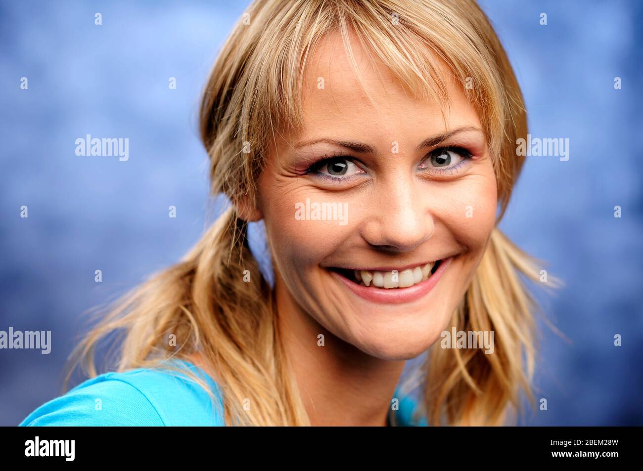 The portrait of young woman with two tails Stock Photo - Alamy