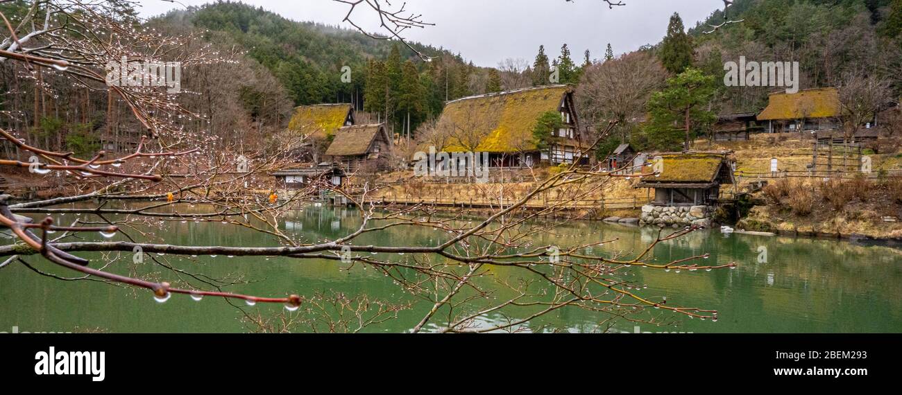 Pond and Hida Folk Village (Hida no Sato) with traditional HIda region ...