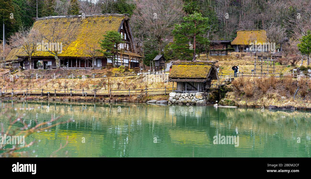 Pond and Hida Folk Village (Hida no Sato) with traditional HIda region ...