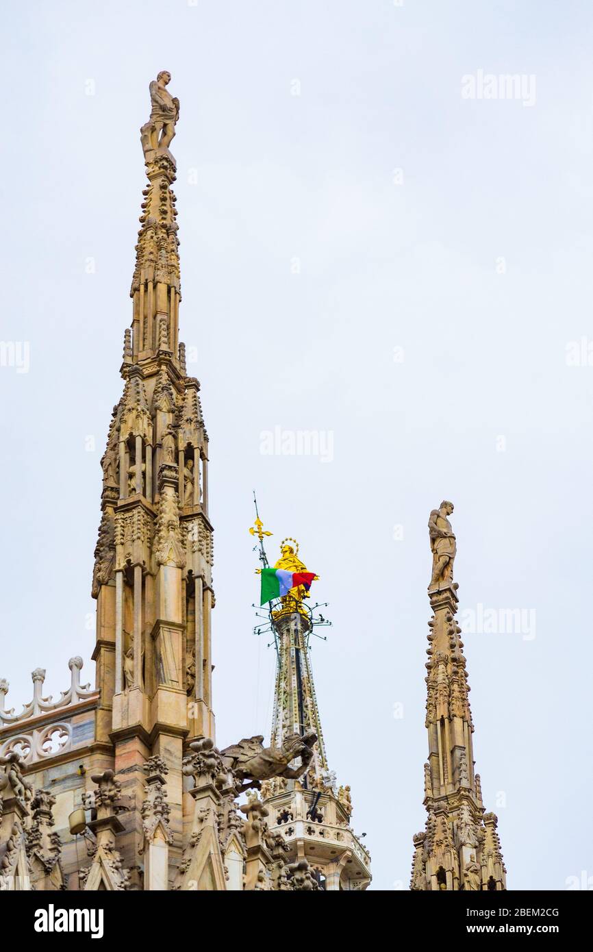 Golden Madonna statue and spires on the rooftop of the gothic Cathedral ...
