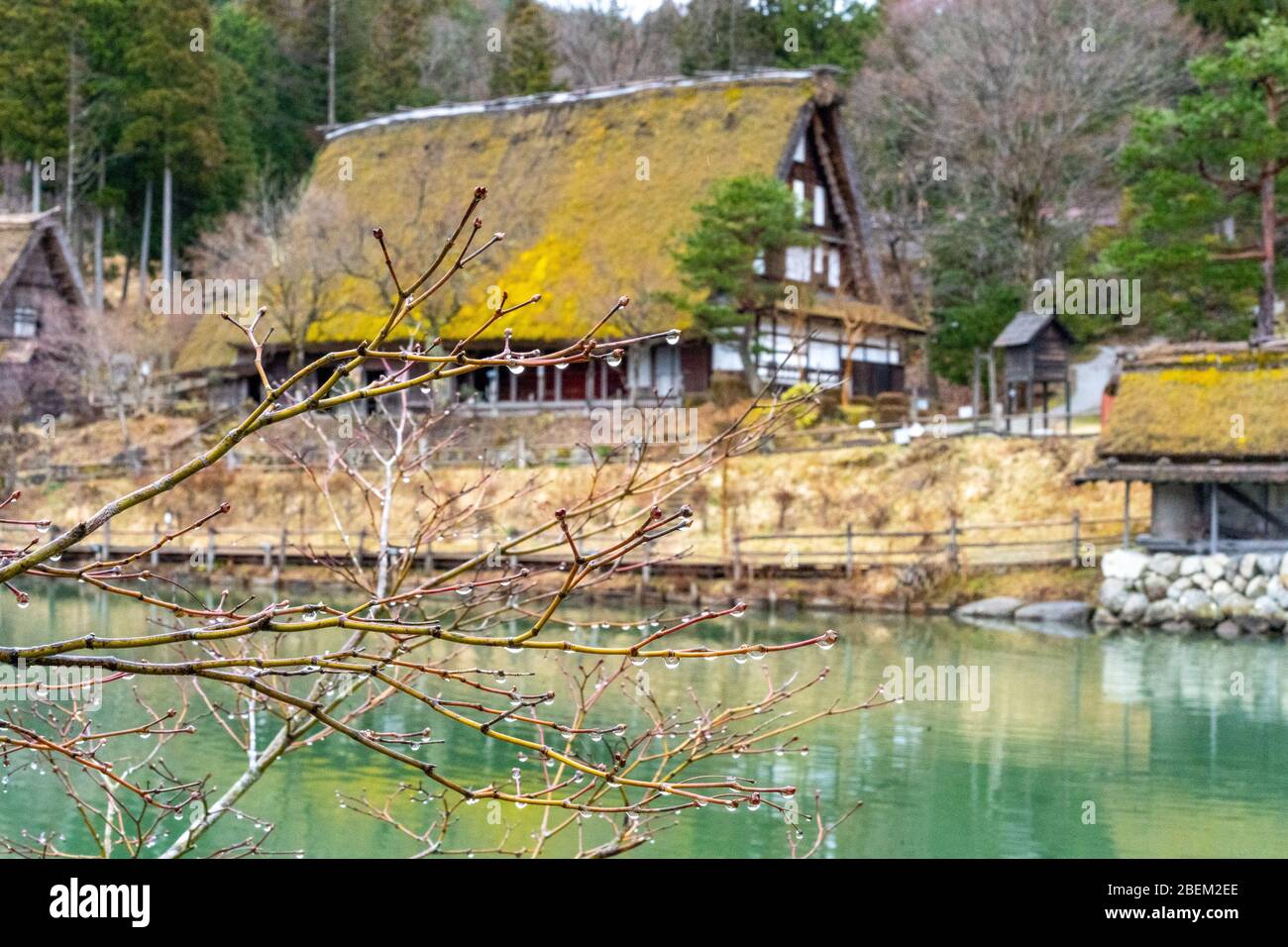 Pond and Hida Folk Village (Hida no Sato) with traditional HIda region ...