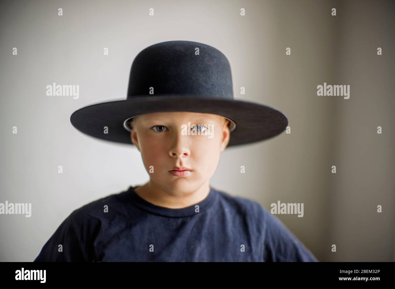 Portrait of a young boy wearing a bowler hat Stock Photo - Alamy