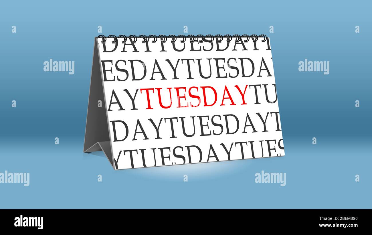 A calendar for the desk shows the day of the week Tuesday Stock Photo ...