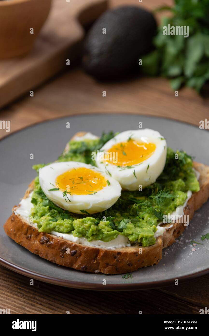 Avocado healthy toast with boiled egg. Square wholegrain bread toast ...