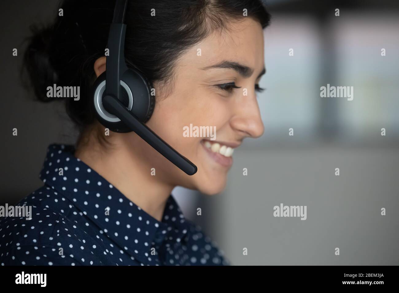 Smiling ethnic woman talk on video call with client Stock Photo - Alamy