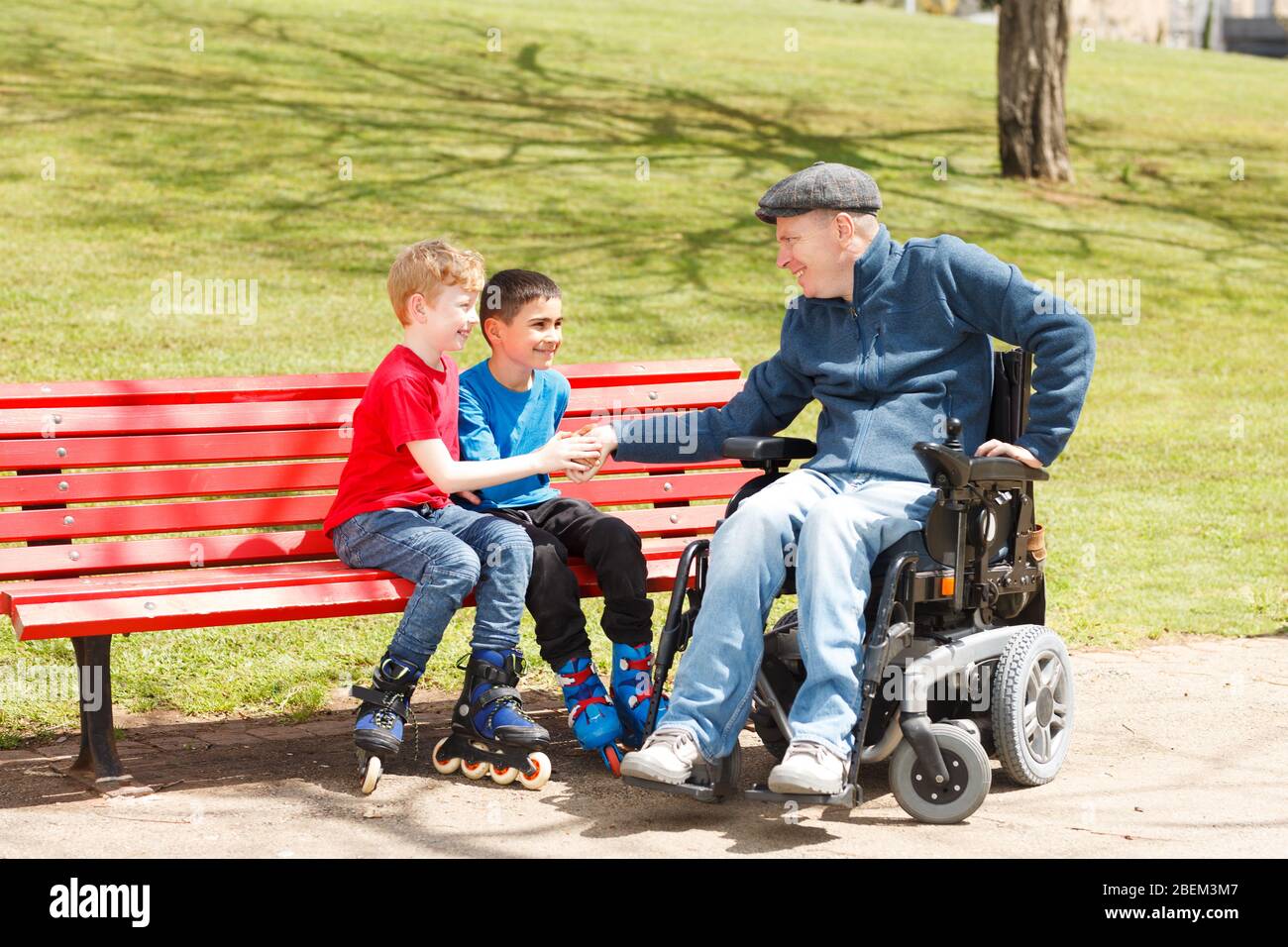 Disabled father play with his sons Stock Photo - Alamy