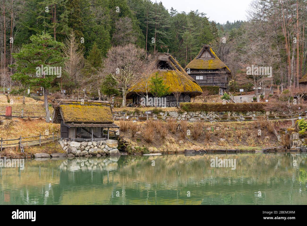 Pond and Hida Folk Village (Hida no Sato) with traditional HIda region ...