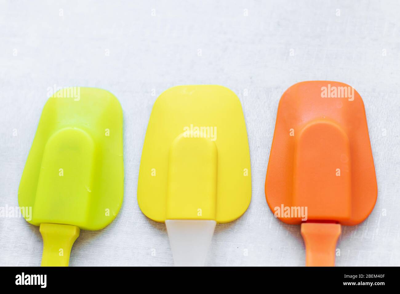 Set of multi-colored silicone spatulas, kitchen tools. Sweet pastries ...