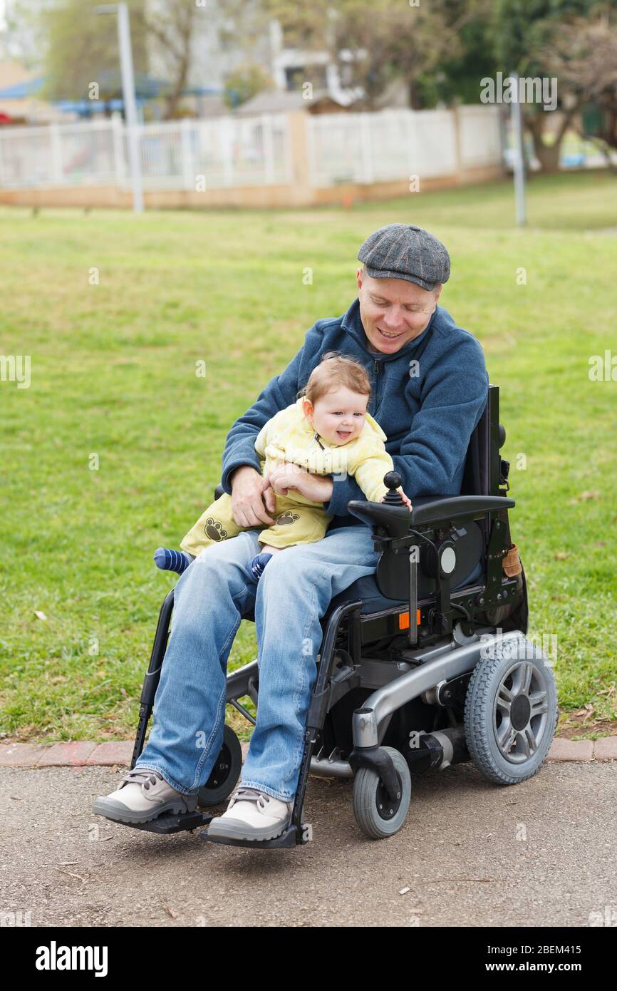 Disabled father play with his little son Stock Photo - Alamy
