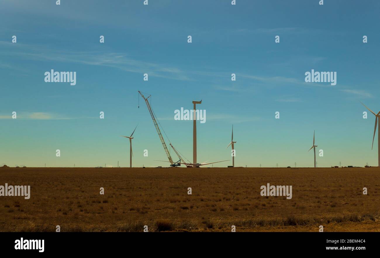 Electric wind turbine windmill installation wind turbine with blue sky ...