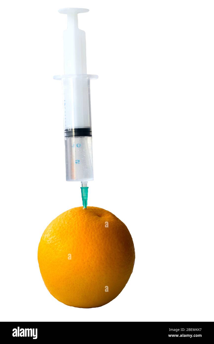 Photo of injection into an orange isolated on a white background Stock ...