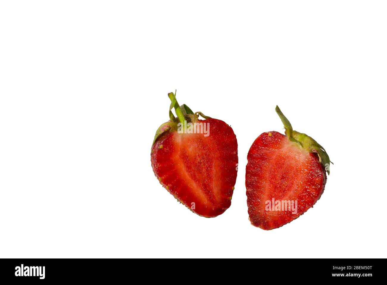 Two halves of a ripe strawberry isolated on a white background Stock ...