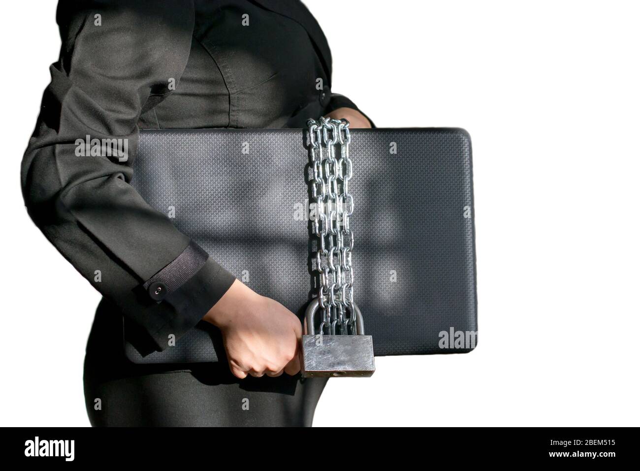 Laptop wrapped in a chain in the hands of a woman isolated on white ...