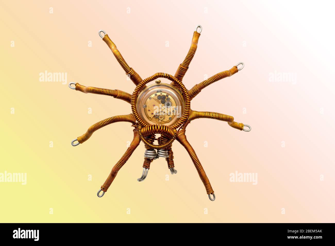 Metal spider with built-in clockwork isolated on light background ...