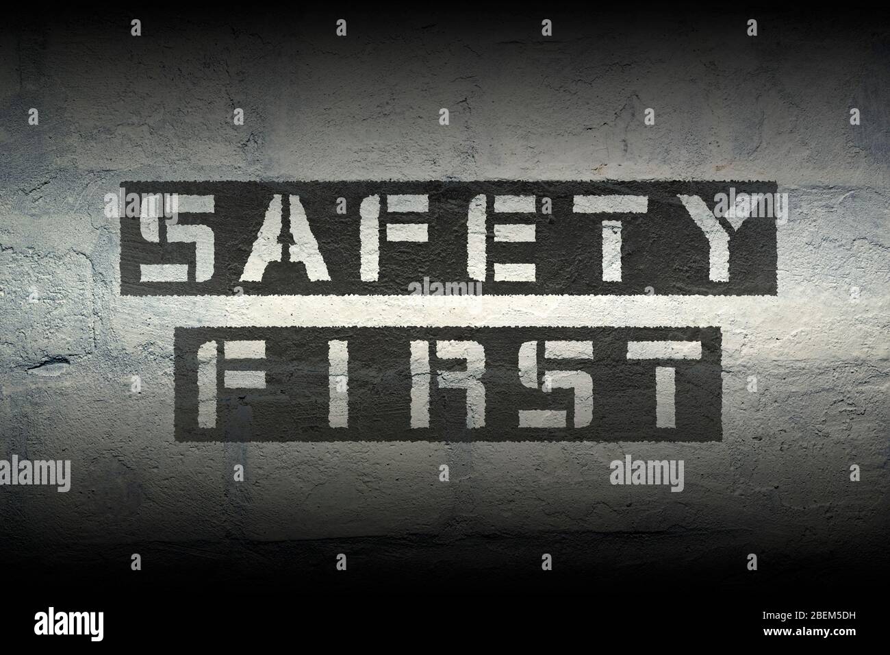 safety first black stencil print on the grunge white brick wall Stock ...