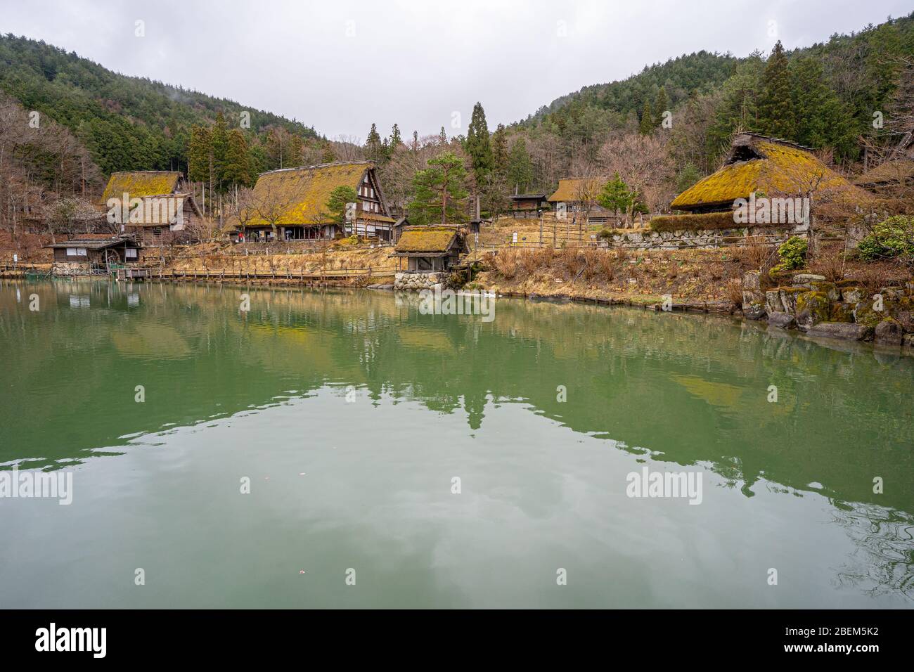 Pond and Hida Folk Village (Hida no Sato) with traditional HIda region ...
