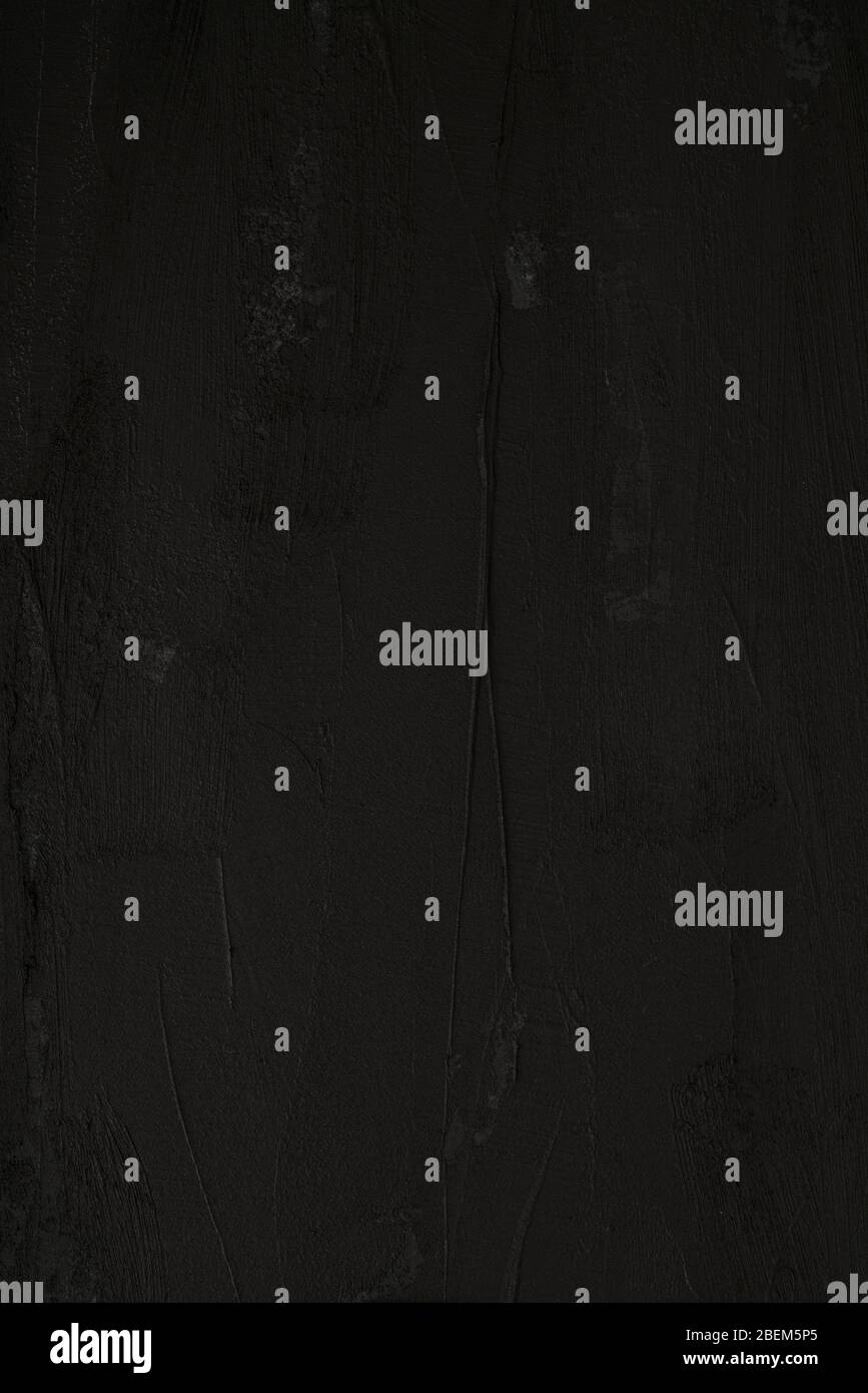 Blank black rough textured wall as a background. concrete floor or old ...