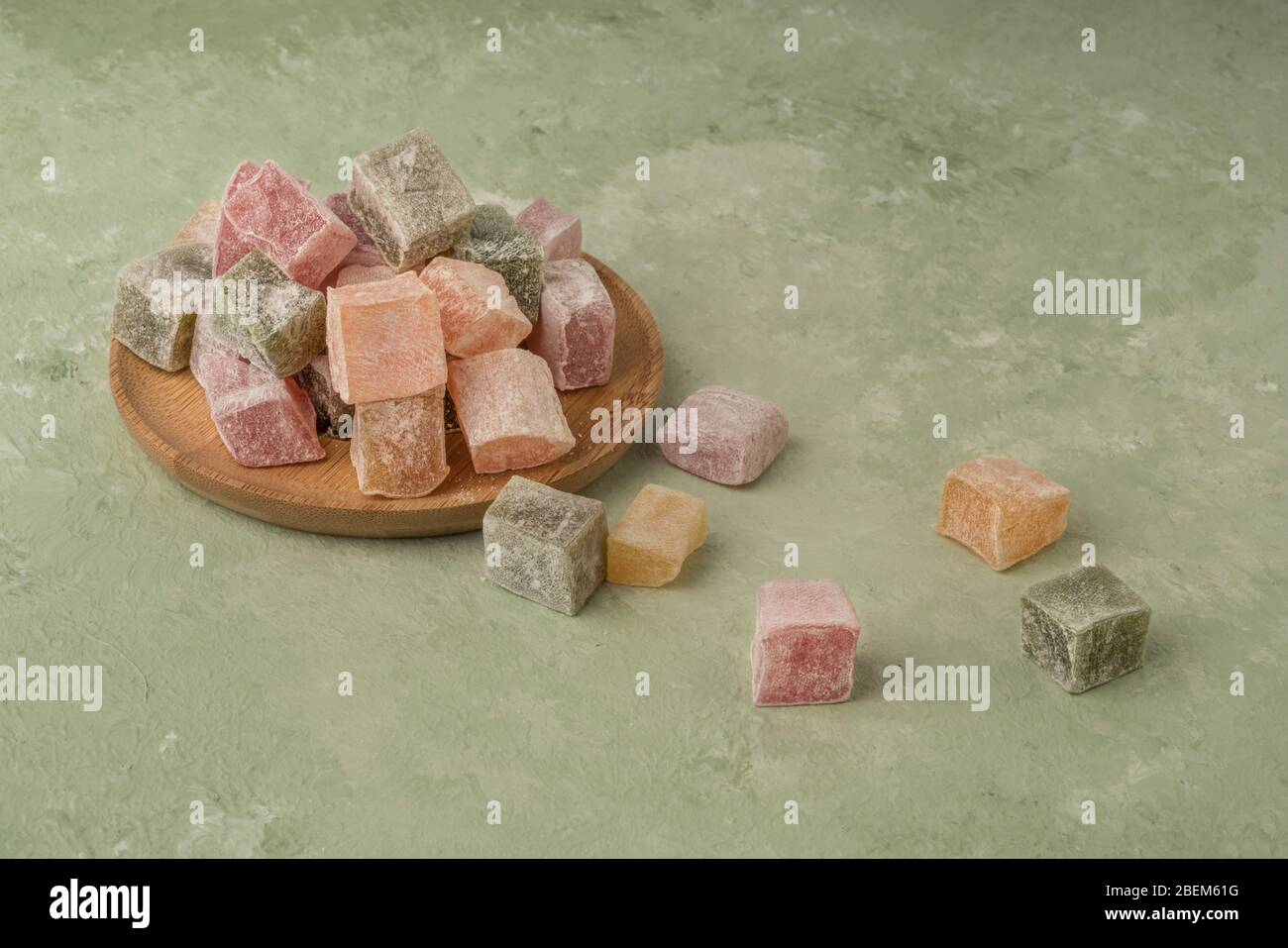 colorful assortment of Turkish delights on a green background with copy ...