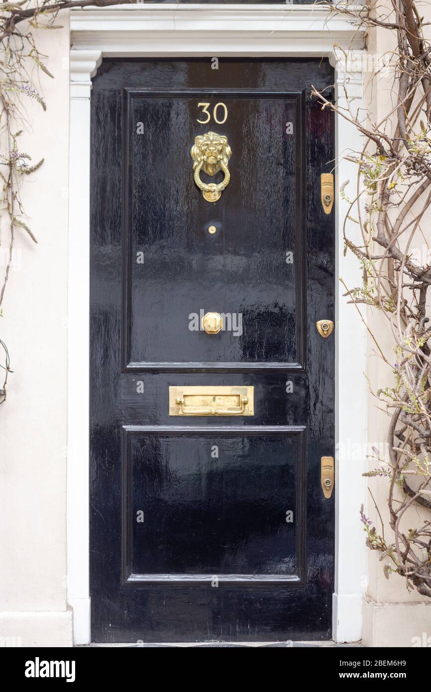 Wooden front door with lion door knocker hi-res stock photography and ...