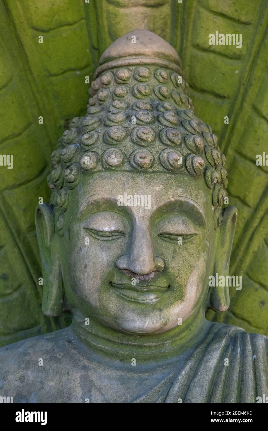 Green stone Buddha face, closeup photo of face of Buddha Stock Photo ...
