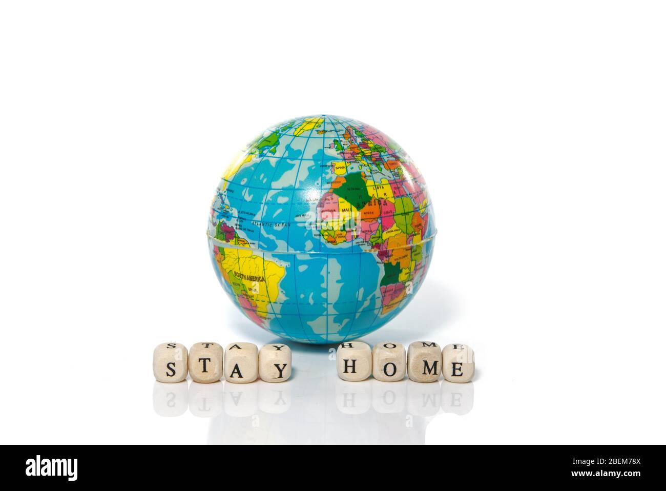 stay home due to coronavirus around the world with a house on white ...