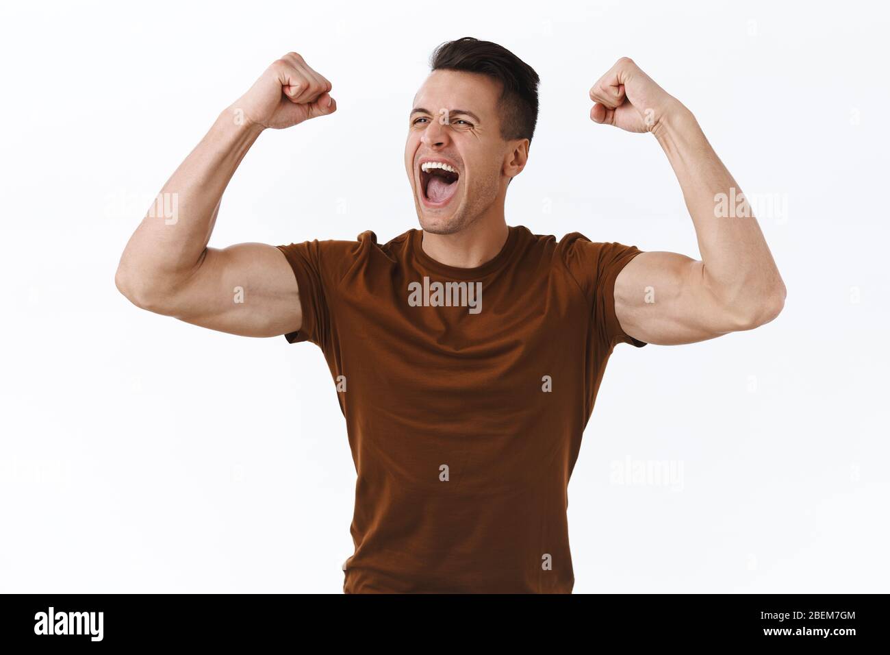 Celebration, sport and fans concept. Portrait of cheerful handsome ...