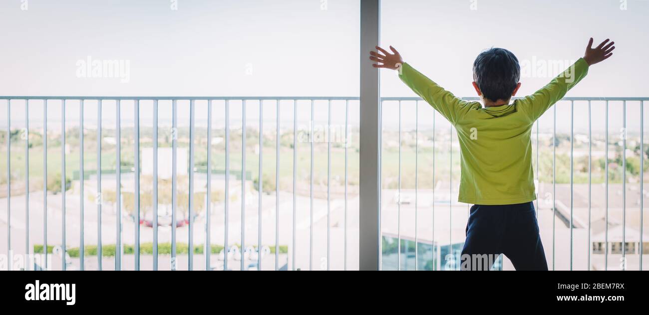 Child looking outside through the window with hope Stock Photo - Alamy