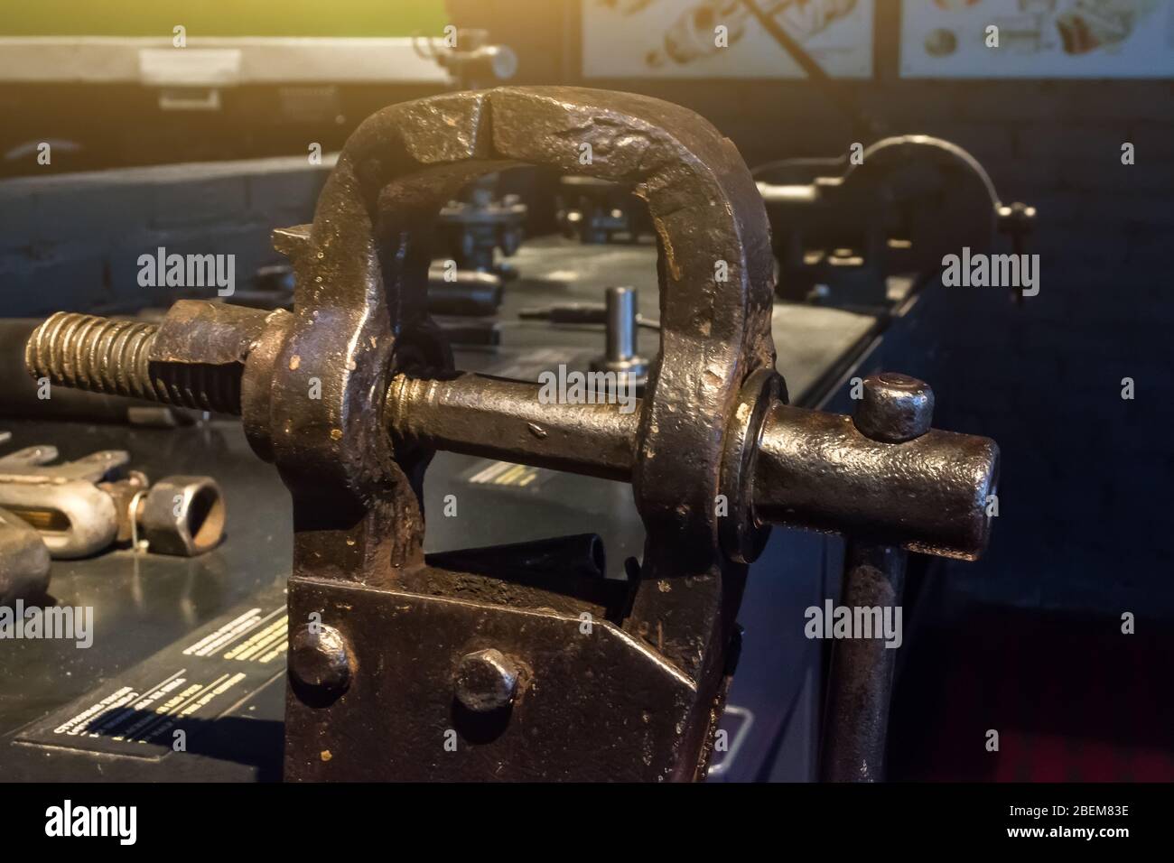 Old metal vise on the table tool Stock Photo - Alamy
