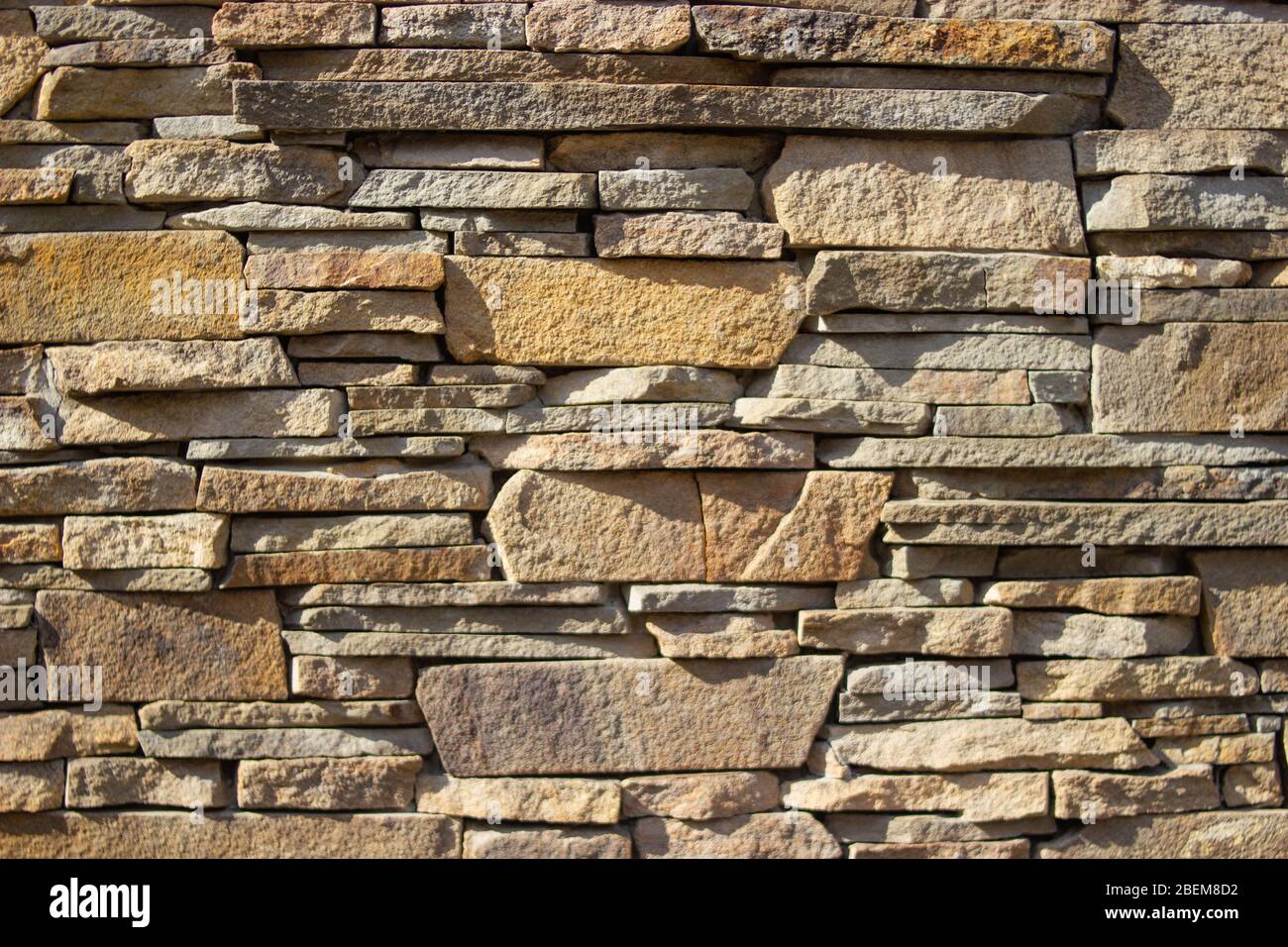 A yellow stone bricks wall Stock Photo - Alamy
