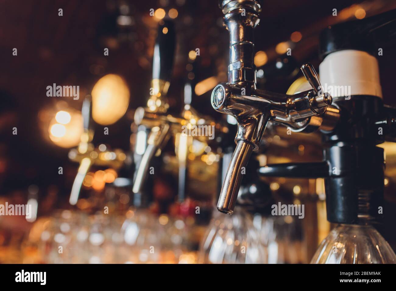 The bar counter with bottles and apparatus for dispensing beer ...