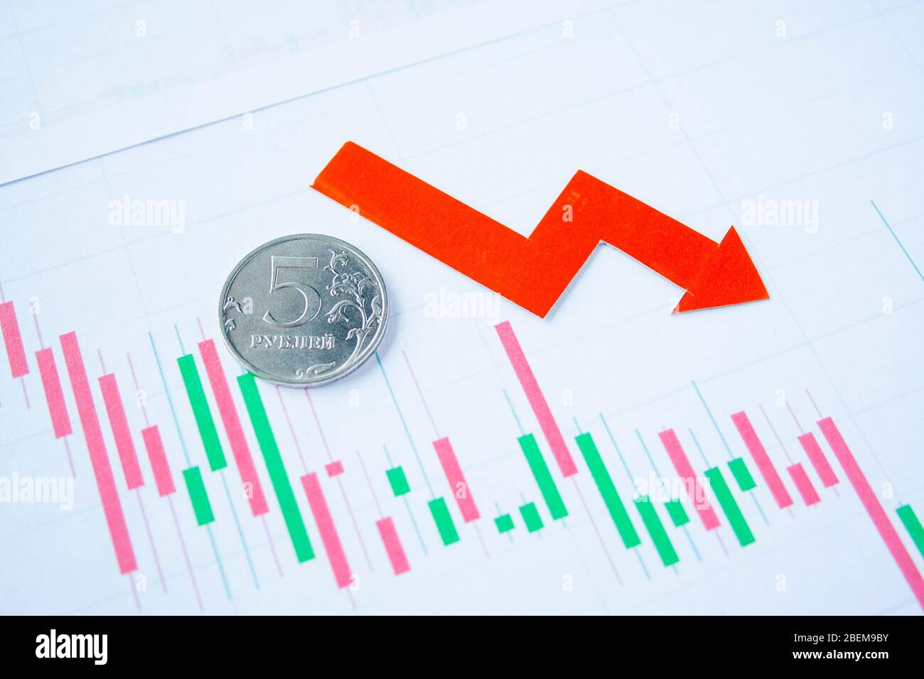 five rouble coin on currency graph with red arrow down. exchange rate ...