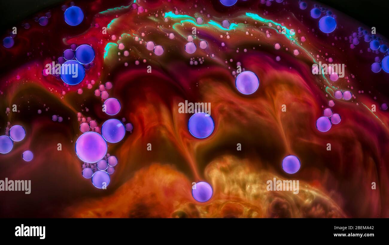 Colorful oil bubbles moving in liquid Stock Photo - Alamy
