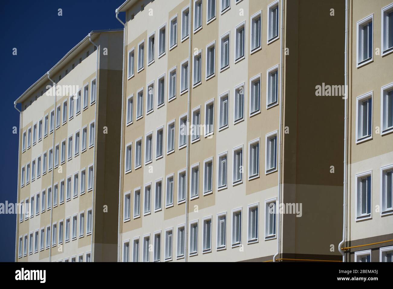 facade of a new multi-storey building with many windows Stock Photo - Alamy