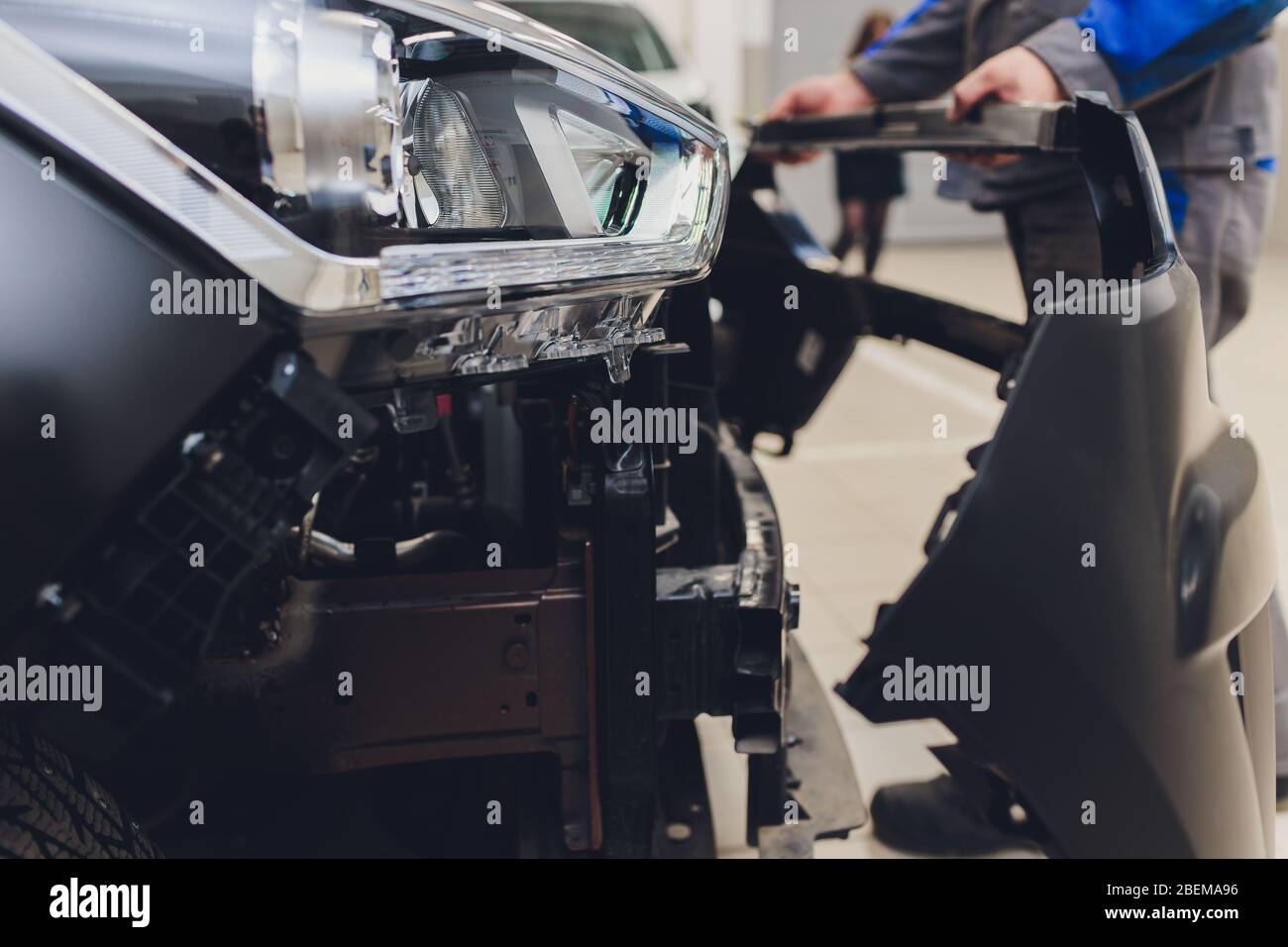 auto mechanic repair car body bumper replacement Stock Photo - Alamy